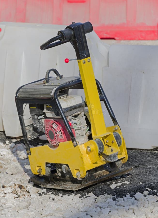 Tamping Machine at Construction Site Stock Photo - Image of compaction ...