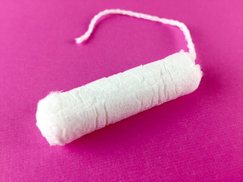 Tampon on a pink surface stock image. Image of menses - 111746907