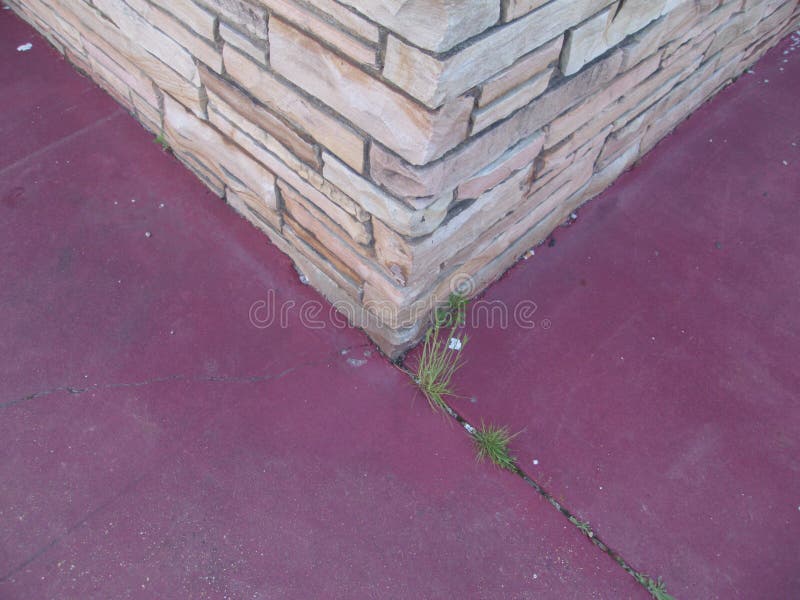 Tan Block Wall With Red Concrete Surface 1 Stock Photo - Image of ...