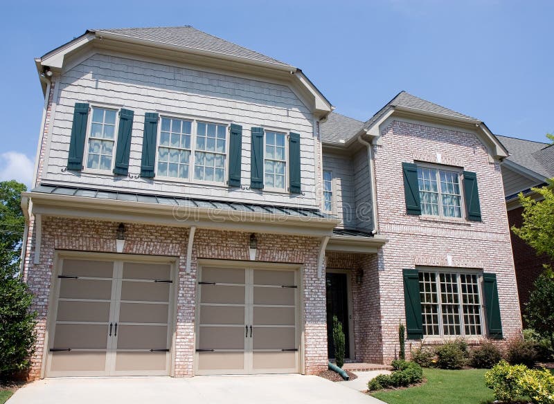 Tan Brick and Siding stock image. Image of blue, home - 5991977