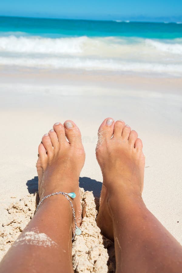 Tan legs on the beach stock photo. Image of beach, long - 164879026