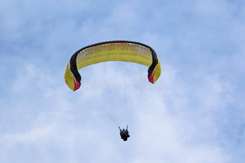 Tandem Paraglider Flying in a Blue Sky Stock Photo - Image of lines ...