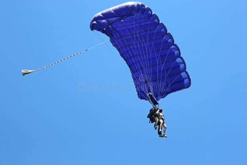 Skydiver Flying Wing in a Blue Sky Editorial Photo - Image of tandem ...
