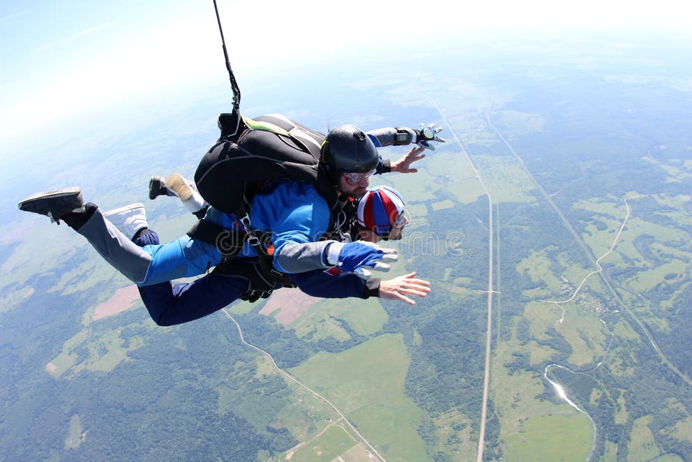Tandem Skydiving. Two Guys are Having Fun in the Sky. Stock Photo ...