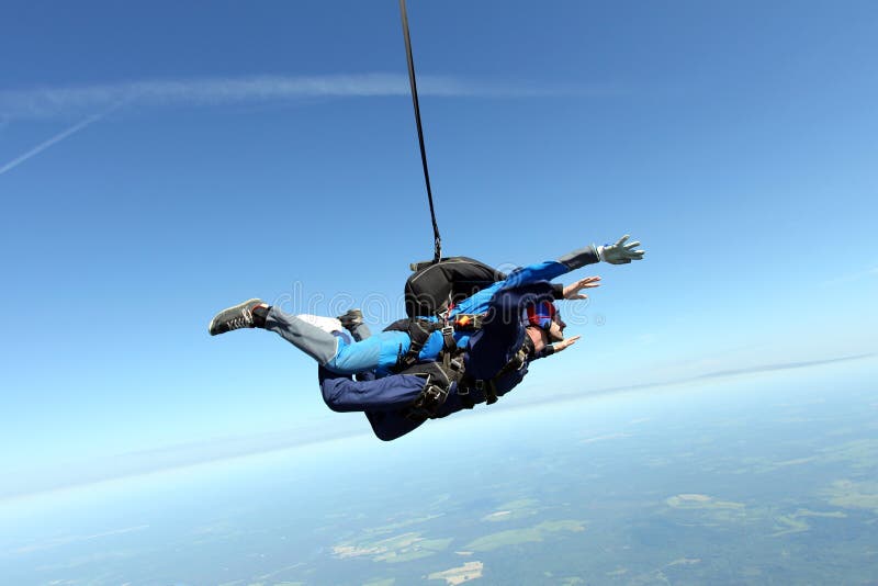 Tandem Skydiving. Two Guys are Having Fun in the Sky. Stock Photo ...