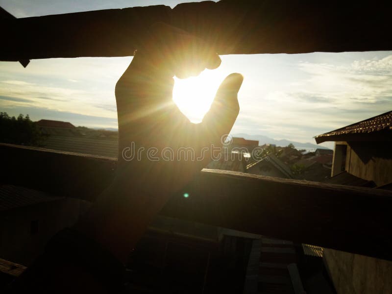 Tangan sunset stock image. Image of sunset, hand, tangan - 89727693