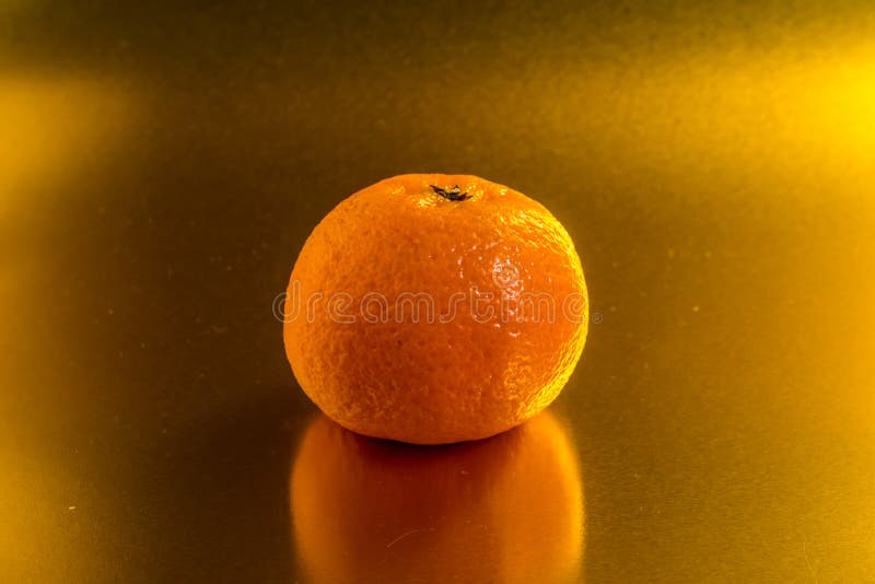 Tangerine on a Gold Background Stock Image - Image of healthy, organic ...