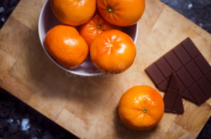 Tangerines with Chocolate Tablet on Wooden Board. Snack and Breakfast ...