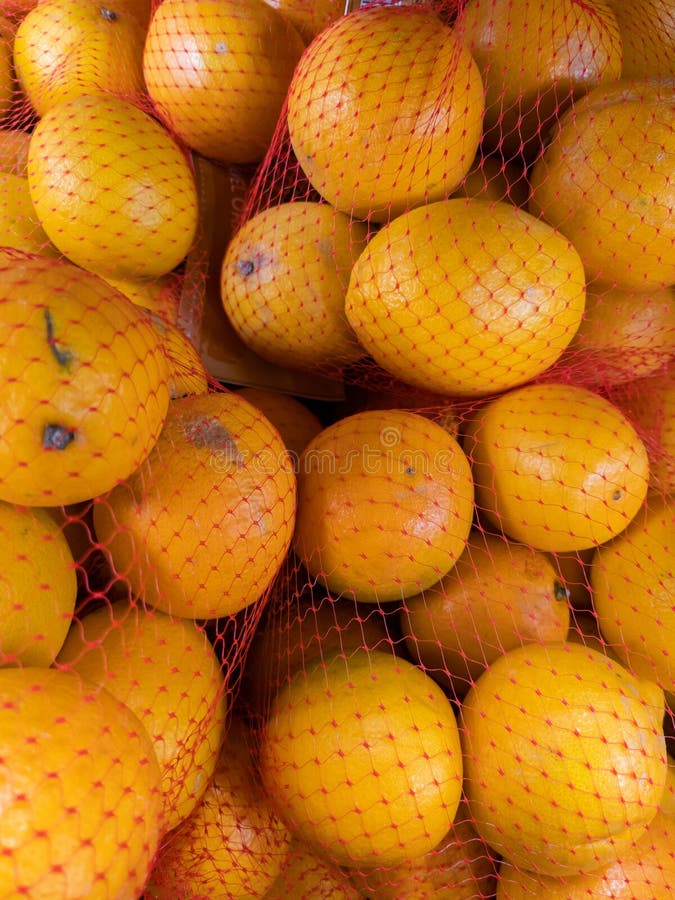 Tangerines in a red net stock image. Image of evergreen - 262408025