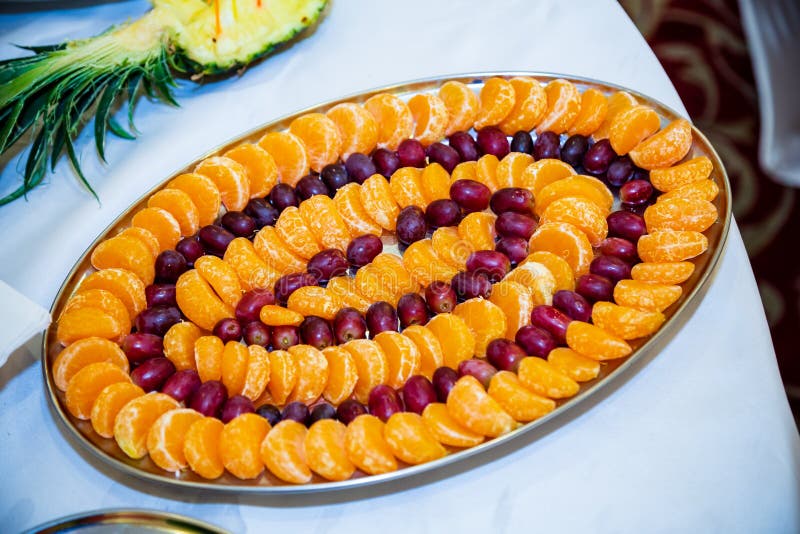 Tray of Grapes and Sliced Tangerines Stock Photo - Image of food, fruit ...