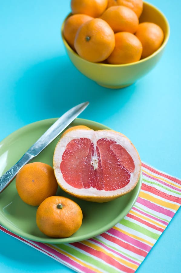 Tangerines and Grapefruit on Plate on Table Stock Photo - Image of ...