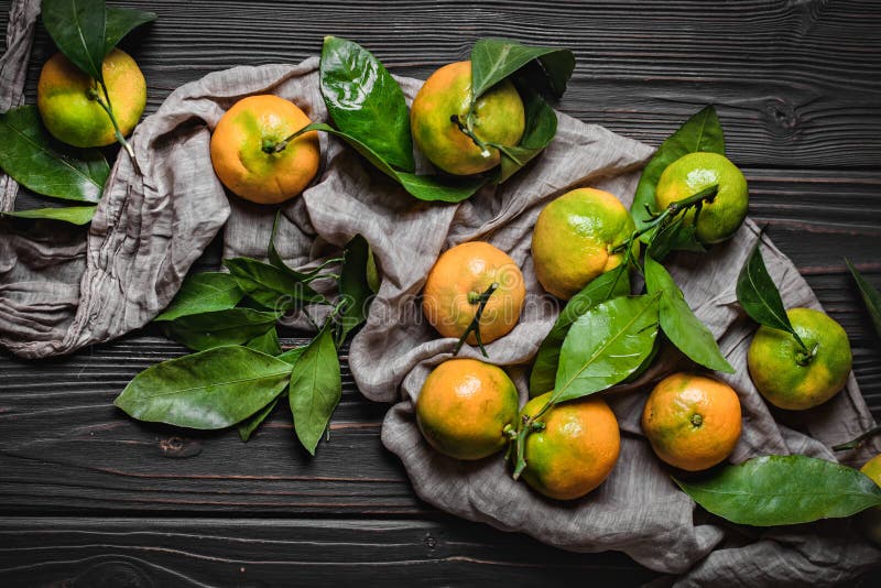 Tangerines with Leaves on an Old Fashioned Country Table. Selective ...