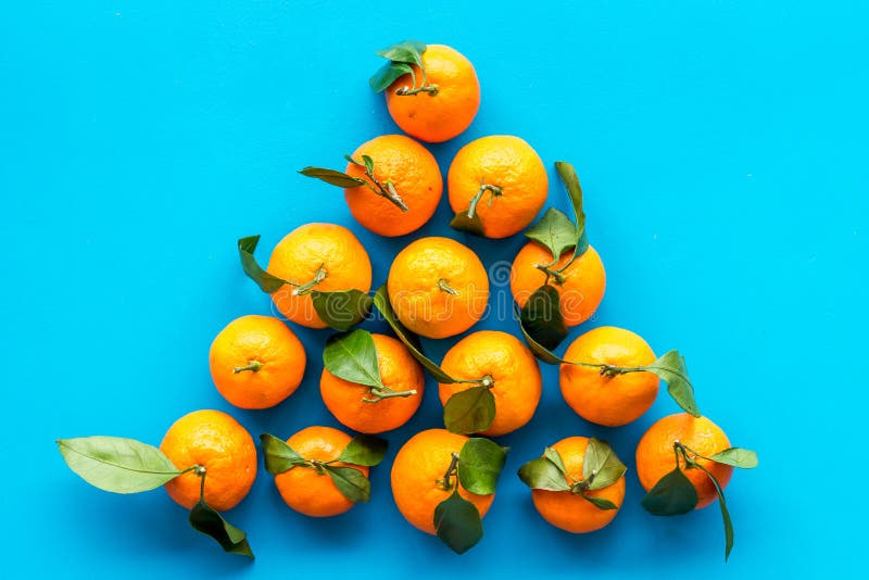 Tangerines with Leaves - Triangle Shape - on Blue Background Top-down ...