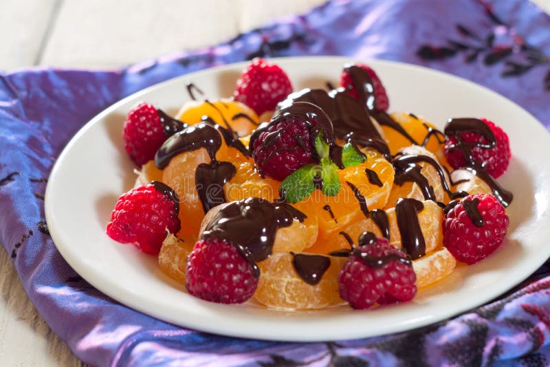 Tangerines and raspberry stock photo. Image of leaf, brown - 35111908