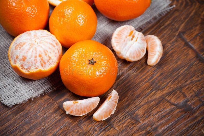 Tangerines on wooden table stock image. Image of pile - 57481915