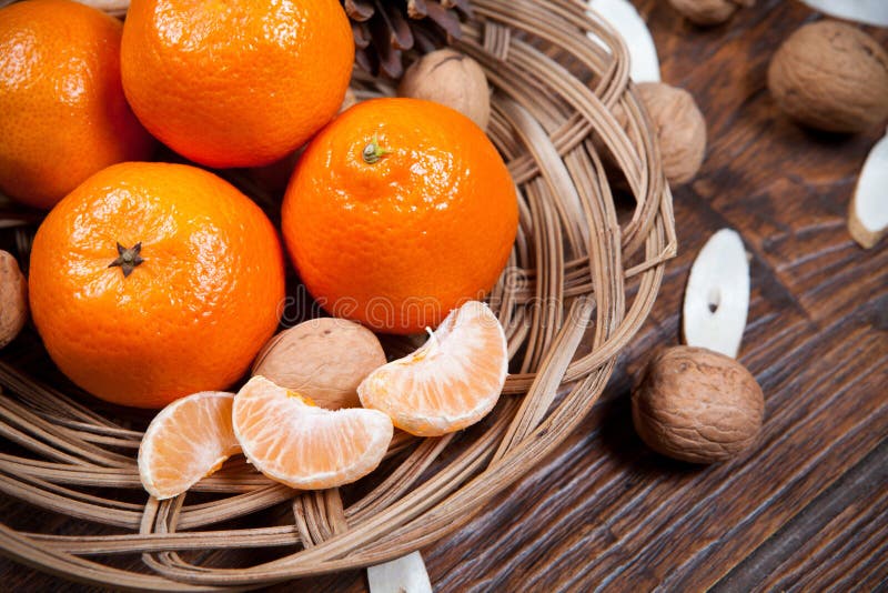 Tangerines on wooden table stock photo. Image of nature - 57485144