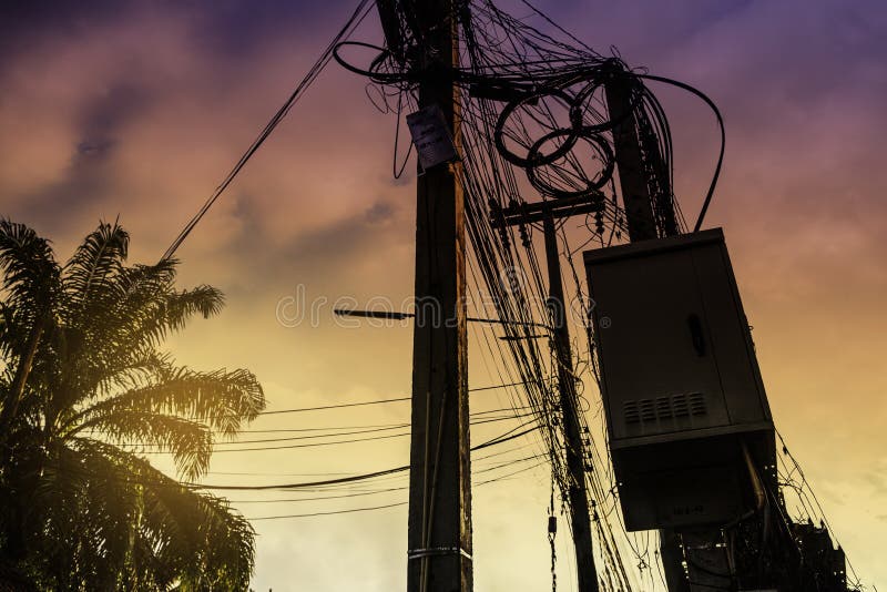 Tangle of Electrical Cables and Communication Wires on Electric Pole ...