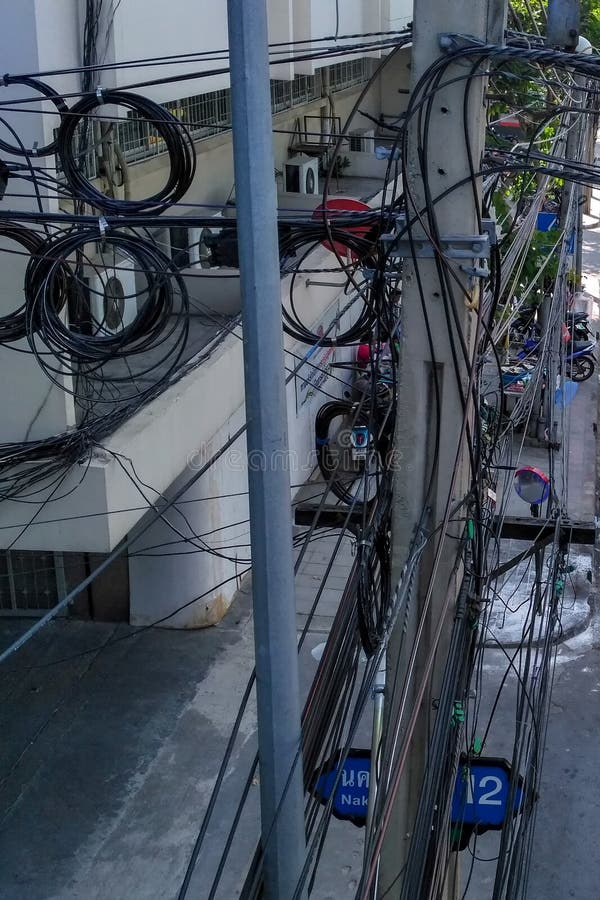 Tangle of Electrical Cables and Communication Wires on Electric Pole ...