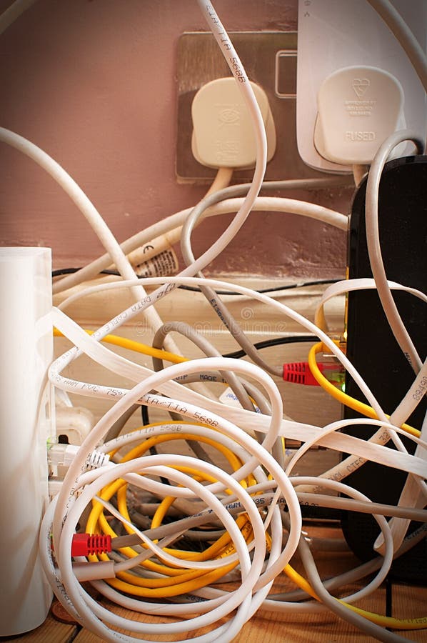 A Tangle of Wires Next To a Plug Socket Stock Image - Image of ...