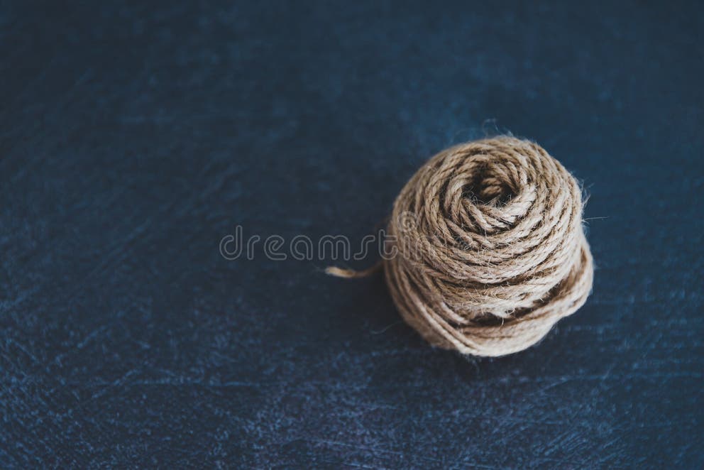 Tangled Ball of Thread with String Popping Out of it Stock Photo ...