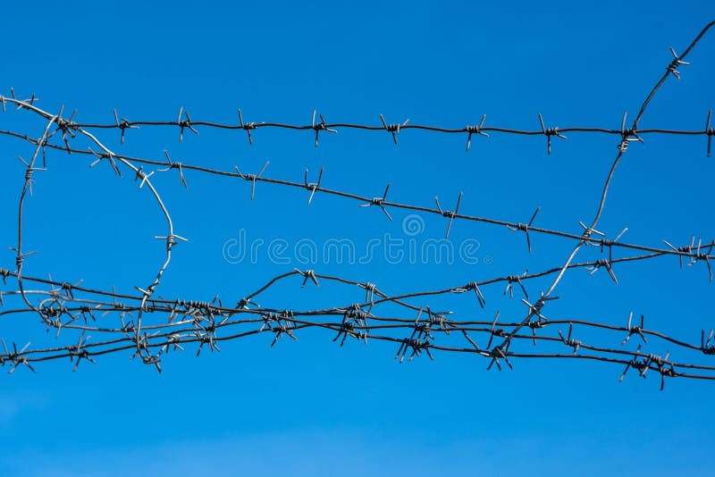 Tangled Barbed Razor Wire Atop Barricade Wall in Southeast Asia Stock ...