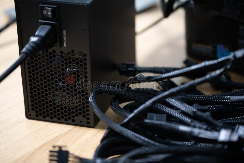 Tangled Black Computer Cables Lying on a Brown Wooden Table Stock Image ...