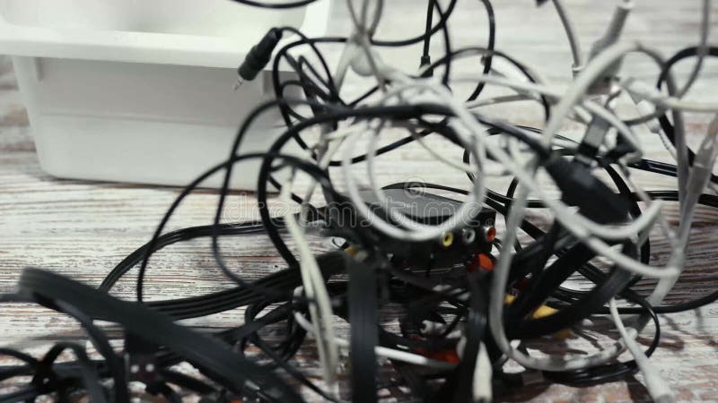 Tangled Cors and Cables on a Table. Stock Video - Video of appliances, battery: 410761839
