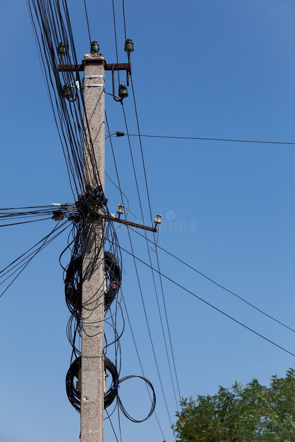 Tangled Electric Cables on Concrete Post. Blue Sky, Selective Focus ...