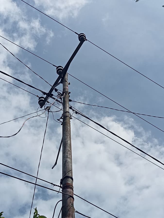 Tangled electricity poles stock image. Image of broken - 306742531