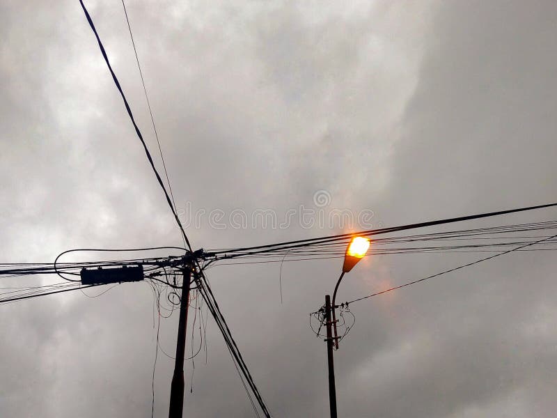 Tangled Fiber Optic Cable Wire and Street Light on Electrical Pole ...