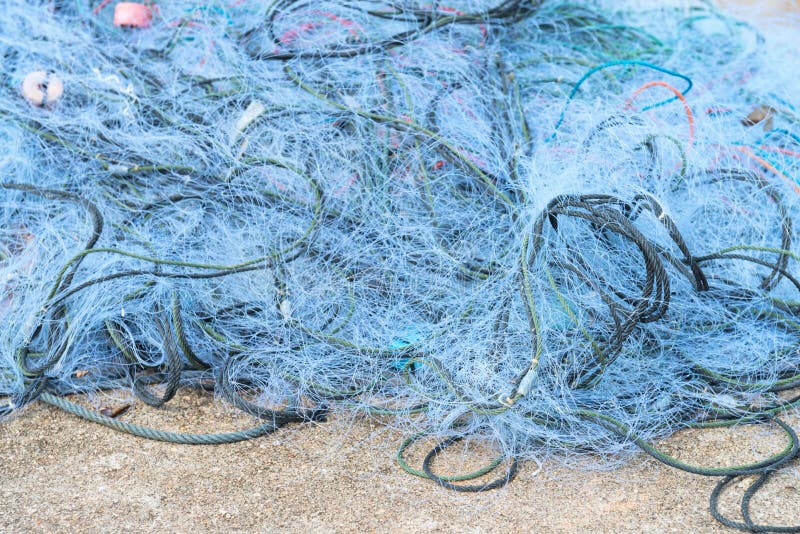 Tangled Fishing Nets Lying on the Ground Stock Photo - Image of string ...