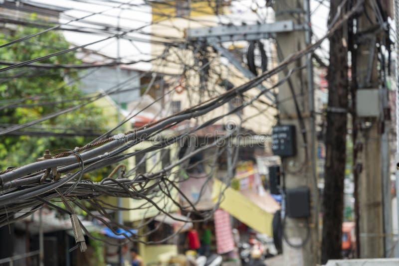Tangled Mess of Eletrical Cables,outdoors and Above the Streets of ...