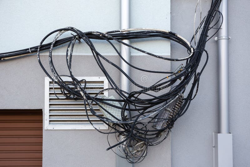 Tangled Messy Electrical Cables on Wall Stock Image - Image of ...