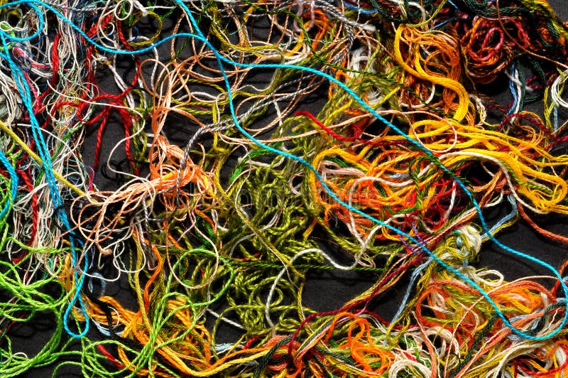 A Lot of Multicolored Knitting Yarn and a Luminous Garland Lie on ...