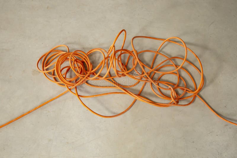 Tangled Orange Electrical Cord, Impossible Problem Stock Image - Image ...
