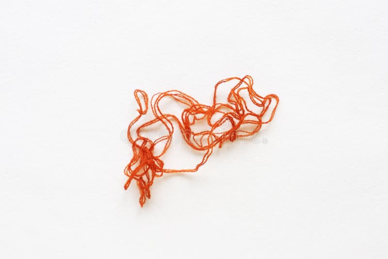 Tangled Orange Thread on White Background Stock Photo - Image of ...