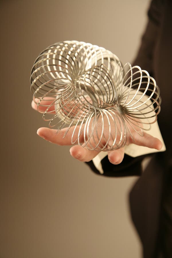 Tangled slinky editorial image. Image of spring, metal - 6277360