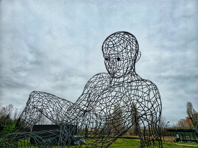 Tangled Wire Sculpture of a Contorted Man at IOR Park in Bucharest ...