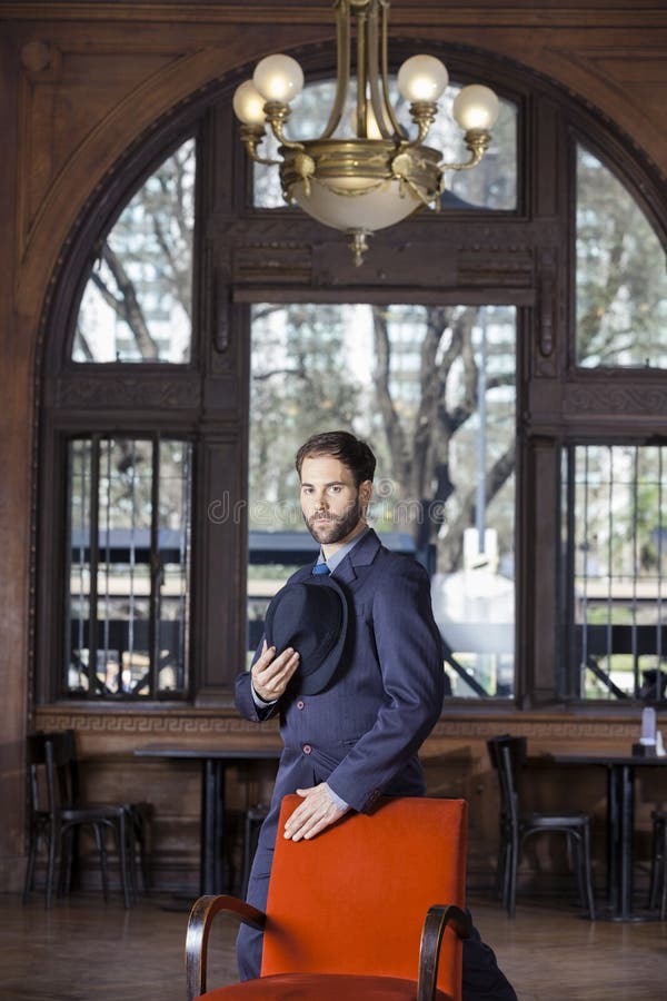 Tango Dancer Holding Hat by Red Chair Stock Photo - Image of argentina ...