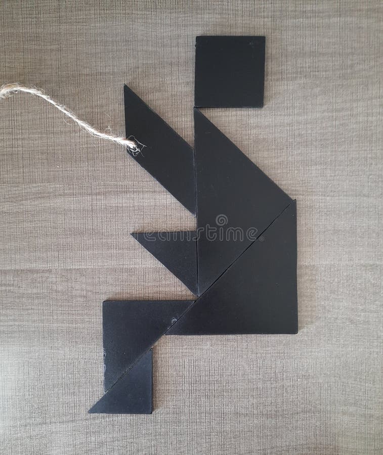 Tangram Figure of a Man Sitting and Pulling a Rope Stock Photo - Image ...