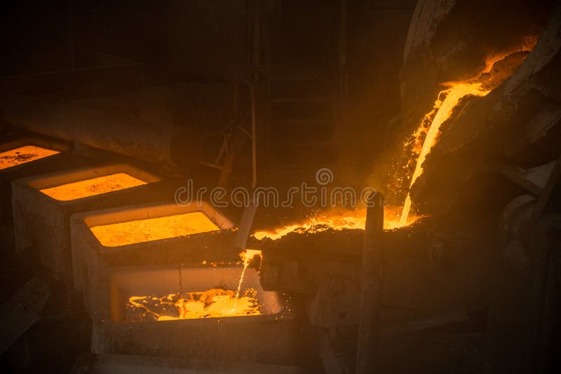 Tank Pours Liquid Metal in the Molds by Carousel Machine Stock Photo ...