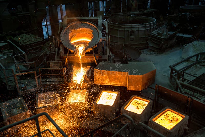 Tank Pours Liquid Metal in the Molds by Carousel Machine Stock Photo ...