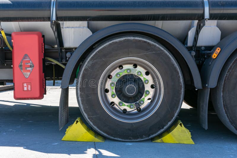 Tank Truck Wheel with Chocks Placed Stock Photo - Image of secure ...