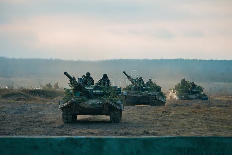 Tanks in Row Masked at Pine Tree Branches in Polygon Stock Photo ...