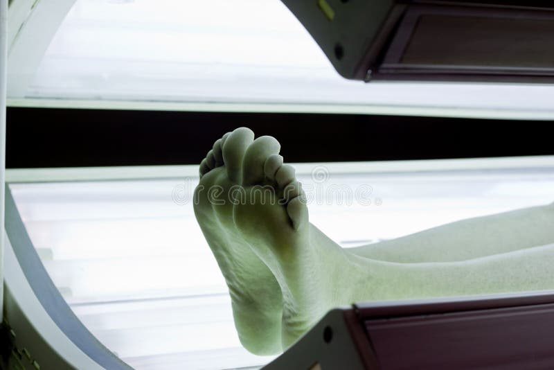 Girl legs in a solarium stock photo. Image of legs, sunbathing - 20150410