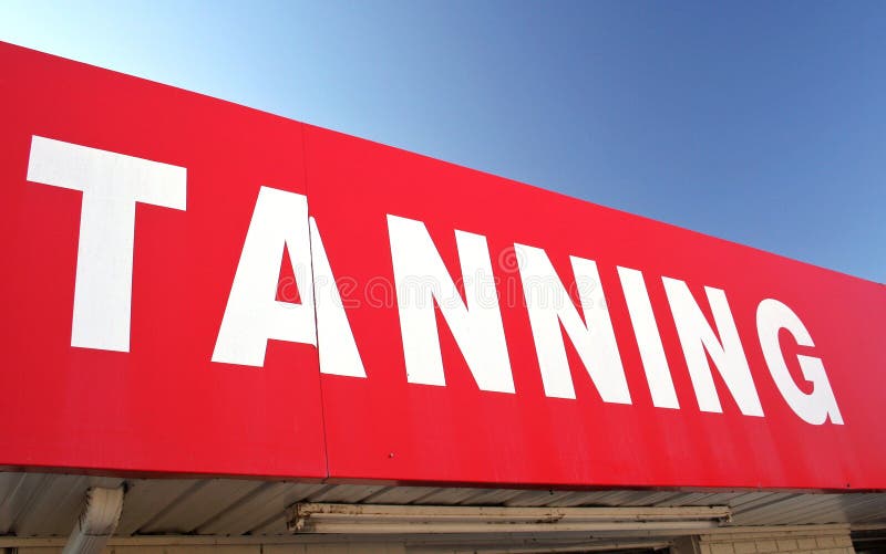 Tanning Sign on Convenience Store Stock Photo - Image of summer, beauty ...
