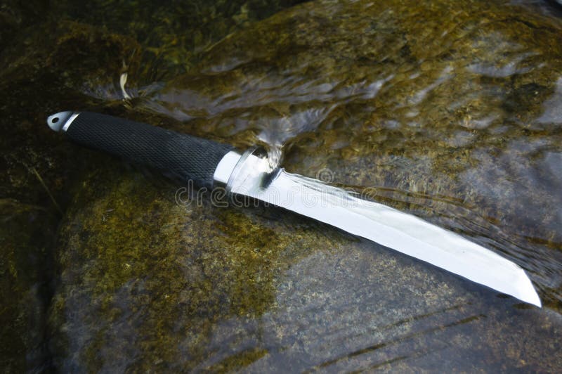 Tanto knife in water stock image. Image of drop, traditional - 30741369