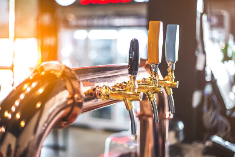 The Beer tap stock photo. Image of liquid, glass, brew - 129757604