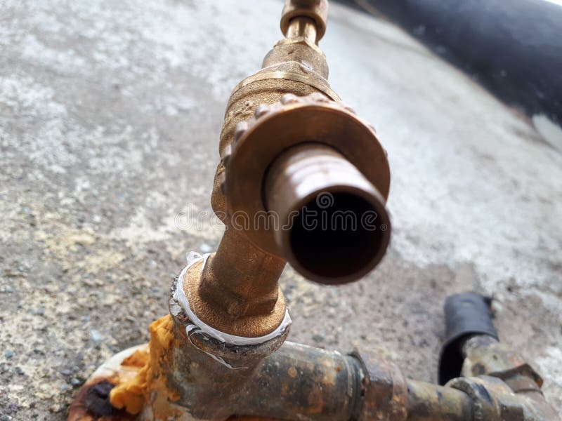 Tap on a concrete wall stock photo. Image of wall, brass - 94412646