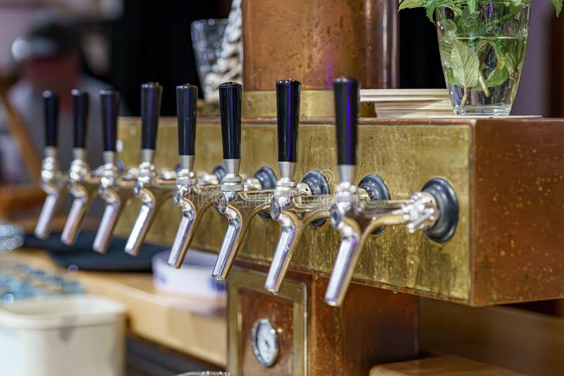A Tap for Dispensing Beer into Glasses in a Beer Bar Stock Image ...